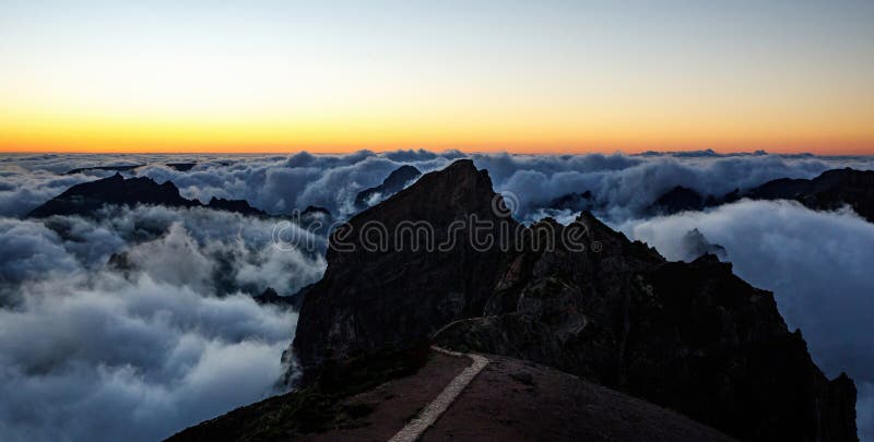 Mountain Pinnacles at Sunset. Clouds Below the Peaks. Stock Photo - Image of stone, evening ...