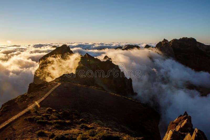Mountain Pinnacles at Sunset. Clouds Below the Peaks. Stock Image ...