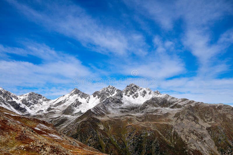 A Mountain Range in the Alps Stock Photo - Image of austria, clouds ...