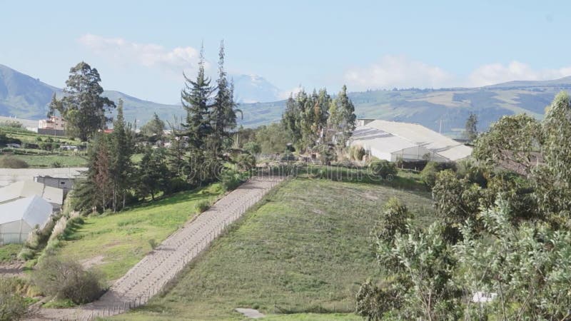 Mountain Range is in the Background of a Rural Area with a Dirt Road ...