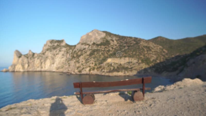 A Mountain Range with a Bench and a Fire Pit. the Sky is Clear and the ...