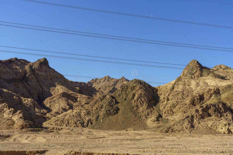 A Mountain Range with a Clear Blue Sky and a Few Birds Flying in the ...