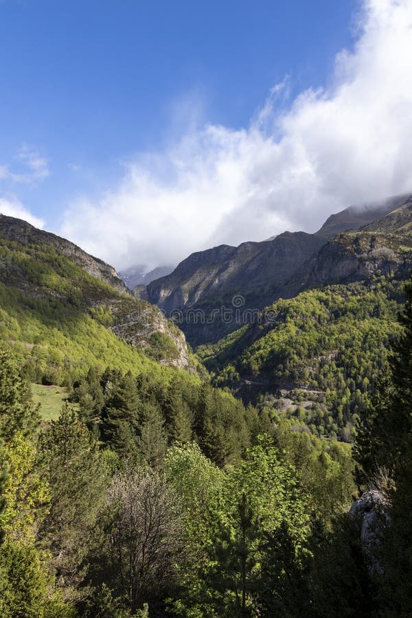 A Mountain Range with a Clear Blue Sky and a Few Clouds Stock Photo ...