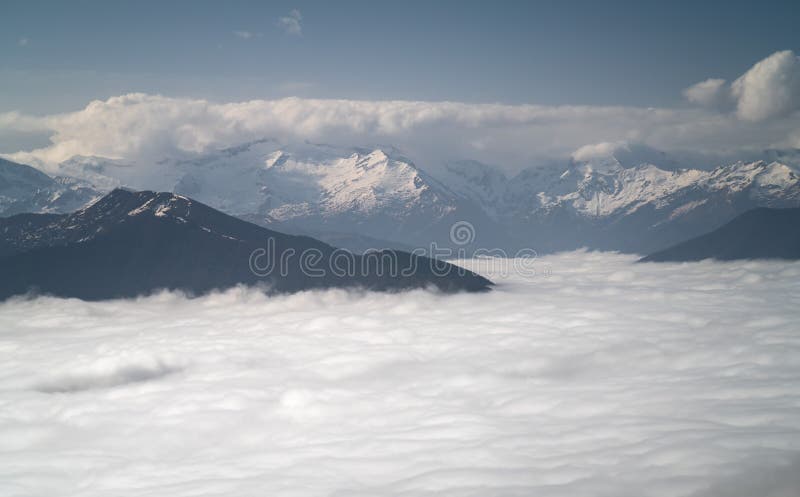 Mountain Range Emerging from the Clouds Stock Image - Image of pyrenees ...