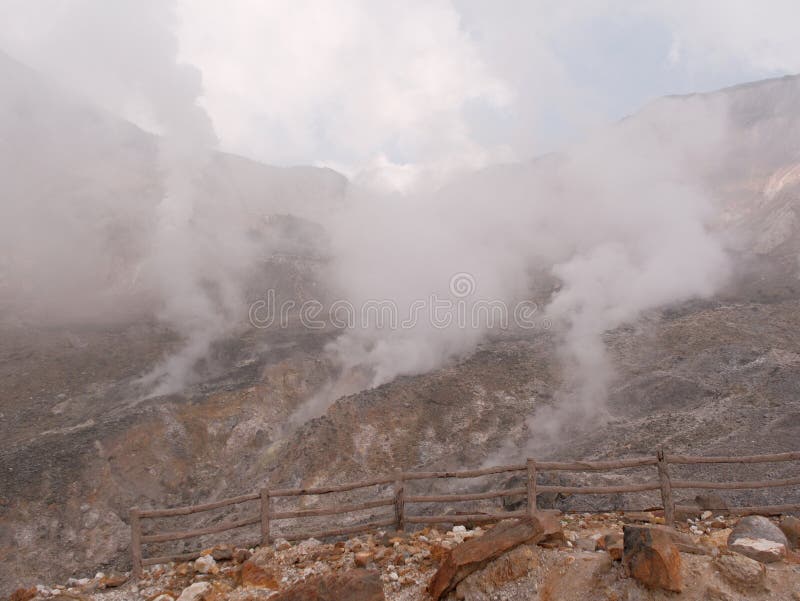 A Mountain Range with a Large Cloud of Smoke Rising from the Top Stock ...