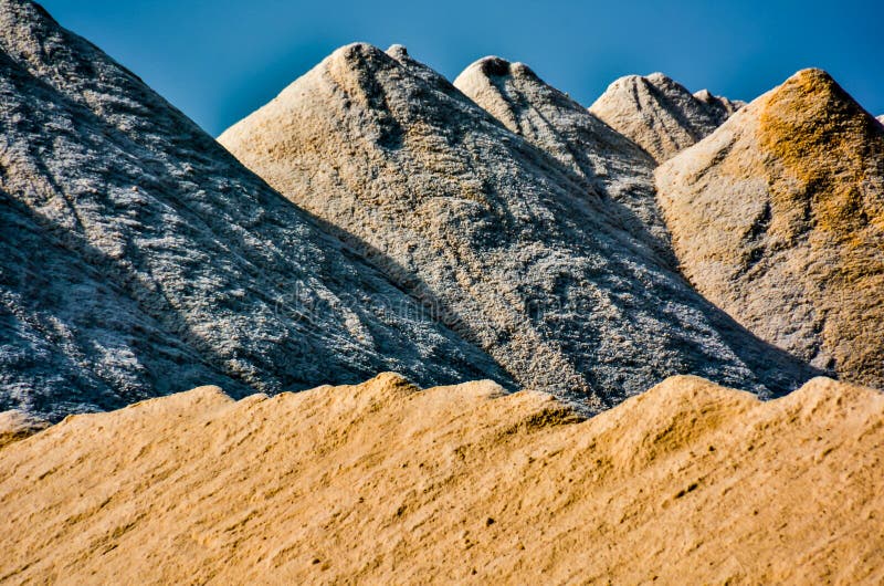 A Mountain Range with a Large Hill in the Foreground Stock Image ...