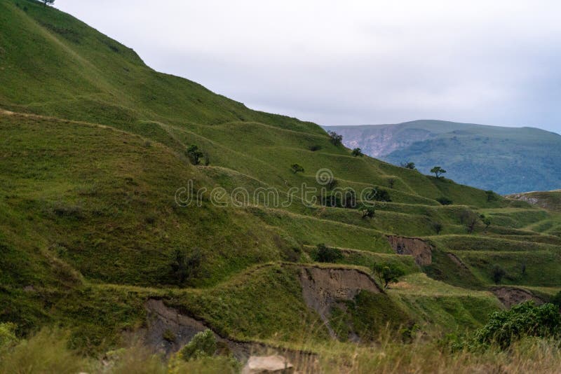A Mountain Range with a Lush Green Hillside Stock Image - Image of ...