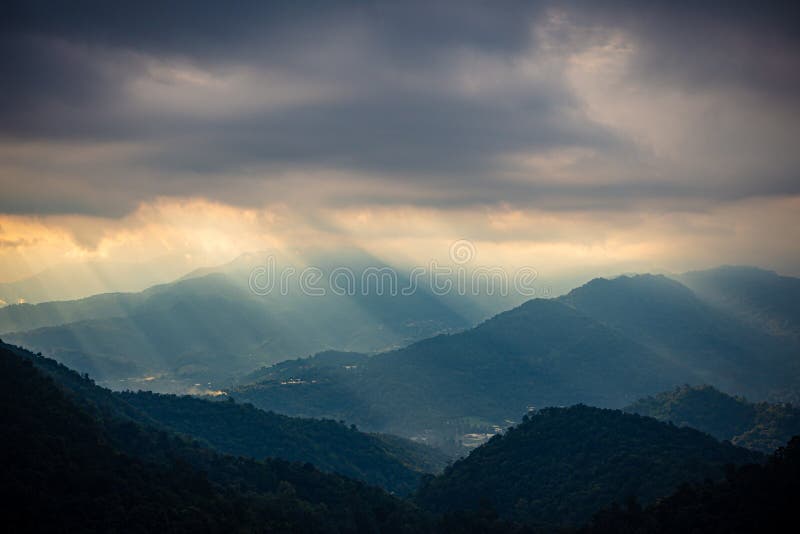 Mountain Range in the Morning with Clouds and Light Shining Down Stock ...