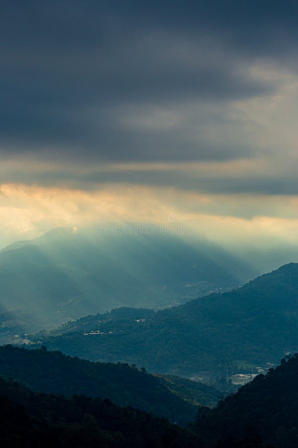 Mountain Range in the Morning with Clouds and Light Shining Down Stock ...