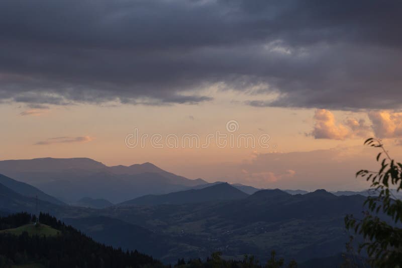 Mountain Range with Partly Cloudy Sky at Sunset. Stock Image - Image of ...