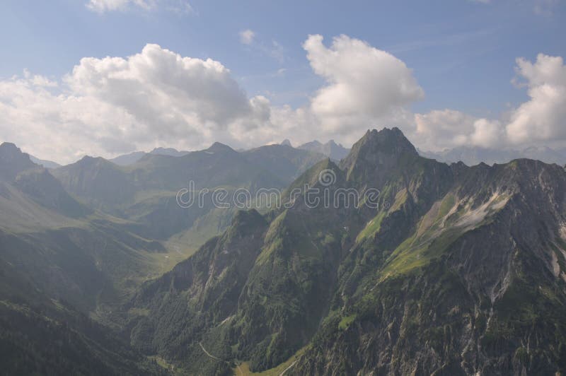 Mountain Range, with Rugged Rocky Mountains and Steep Slopes Covered by ...