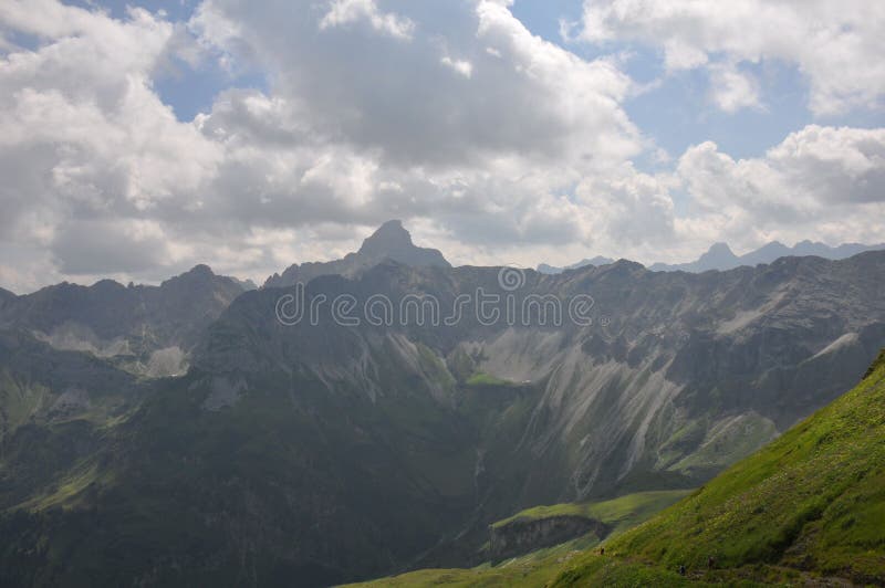 Mountain Range, with Rugged Rocky Mountains and Steep Slopes Covered by ...