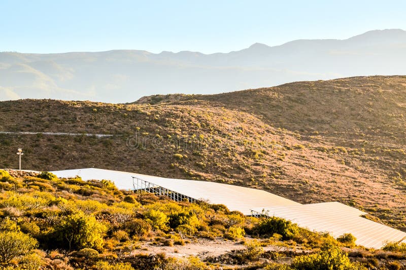A Mountain Range with a Solar Farm in the Middle Stock Photo - Image of ...