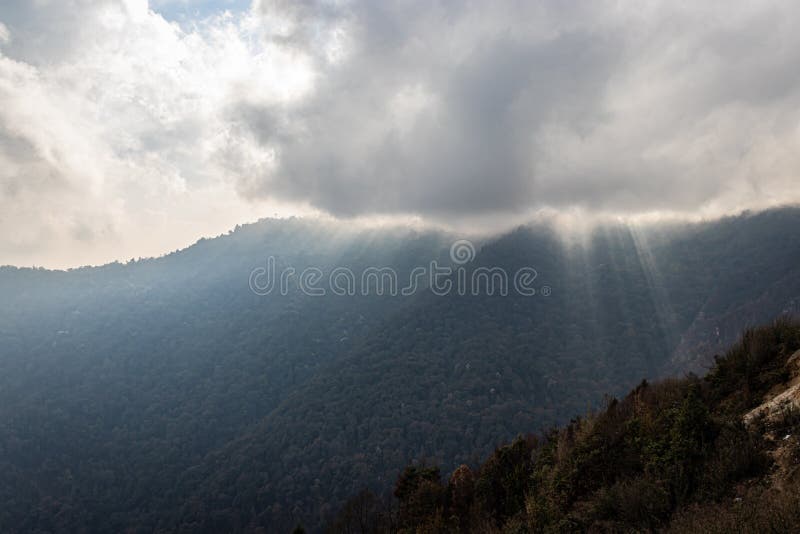 Mountain Range with Sun Ray Beams and Heavy Cloud Overcast at Day Stock ...