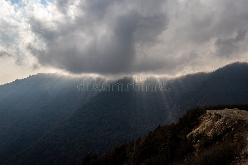 Mountain Range with Sun Ray Beams and Heavy Cloud Overcast at Day Stock ...