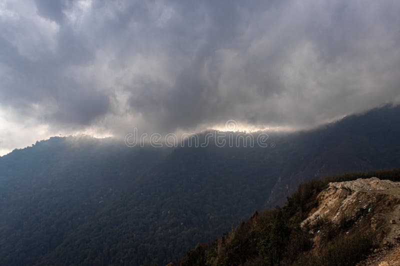 Mountain Range with Sun Ray Beams and Heavy Cloud Overcast at Day Stock ...