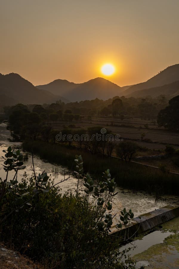 Mountain Range with Sunset Dramatic Orange Sky at Dusk from Flat Angle ...