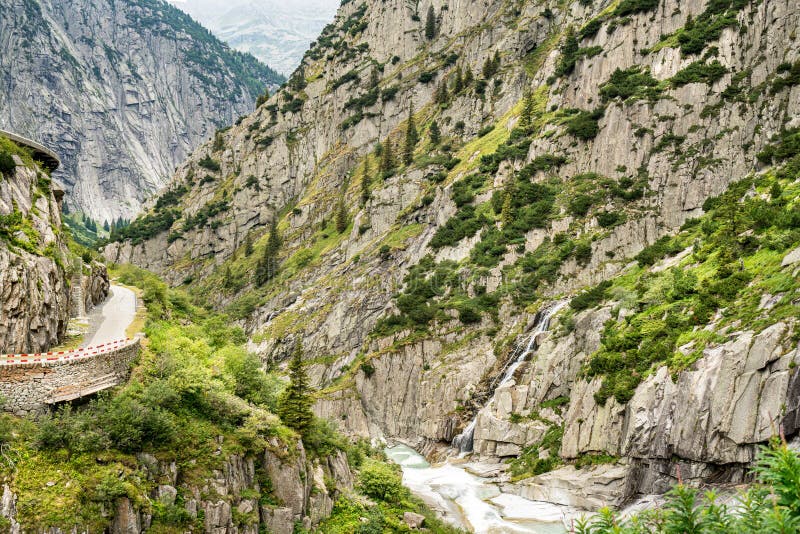 A Mountain Range in the Swiss Alps with a River Running through it ...