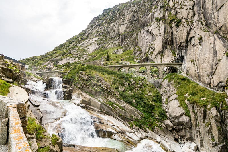 A Mountain Range in the Swiss Alps with a River Running through it ...