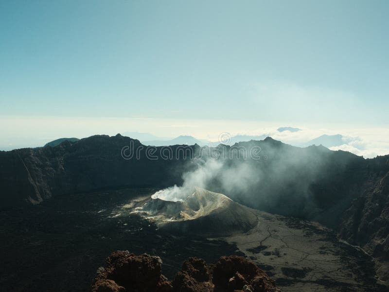 A Mountain Range with a Volcano in the Middle Stock Image - Image of ...