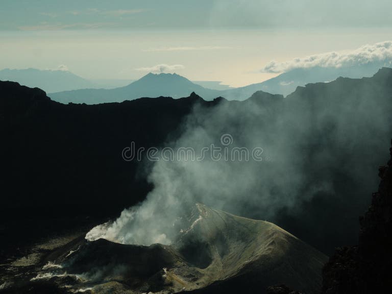 A Mountain Range with a Volcano in the Middle Stock Photo - Image of ...
