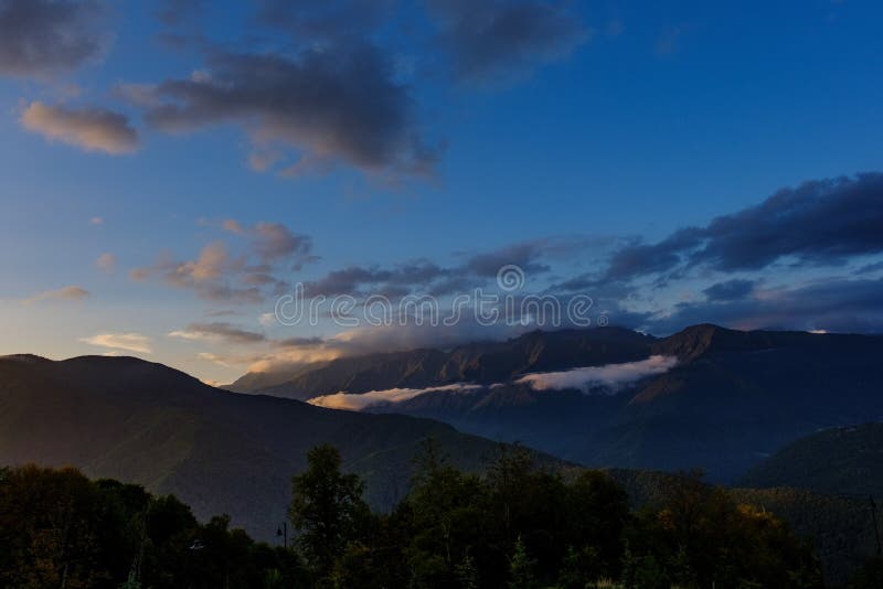 Mountain Ranges and Clouds in the Evening Light. Stock Photo - Image of ...