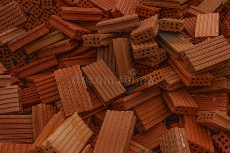 A Mountain of Red and Brown Clay Bricks on a Construction Site. a Close ...