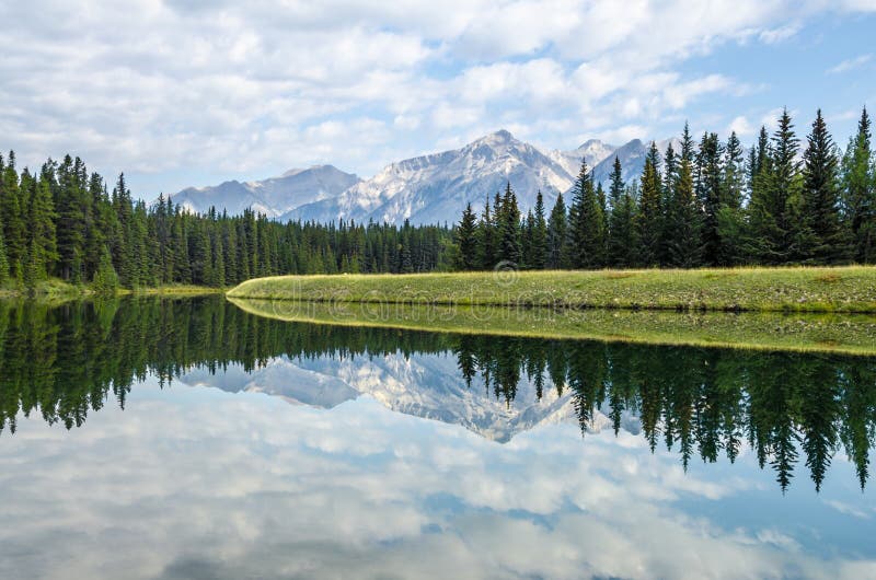 Mountain Reflection in Motionless Water Stock Photo - Image of canal ...
