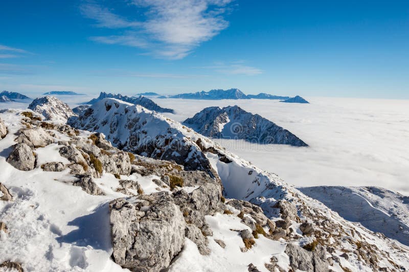 Mountain Ridge Above the Clouds Stock Photo - Image of snow, mountain ...