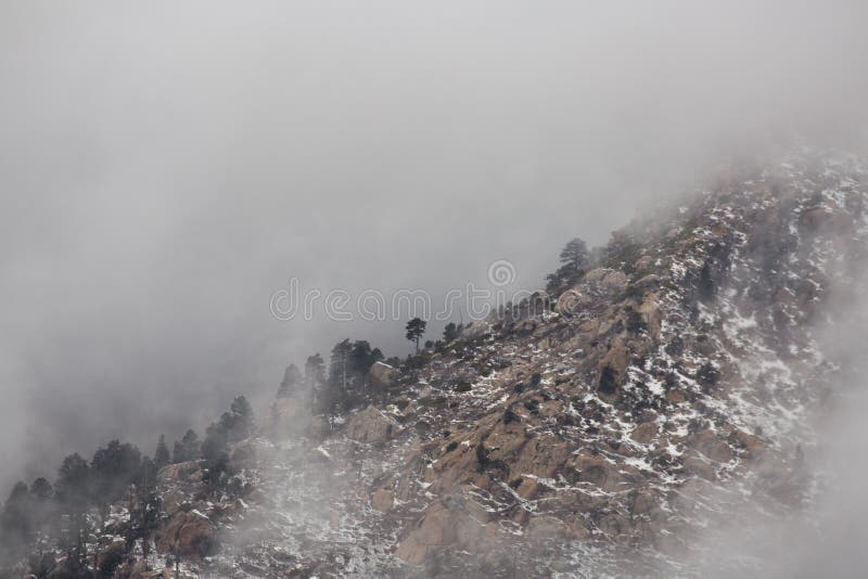 Mountain Ridge Appearing through the Fog on a Winter Day Stock Photo ...