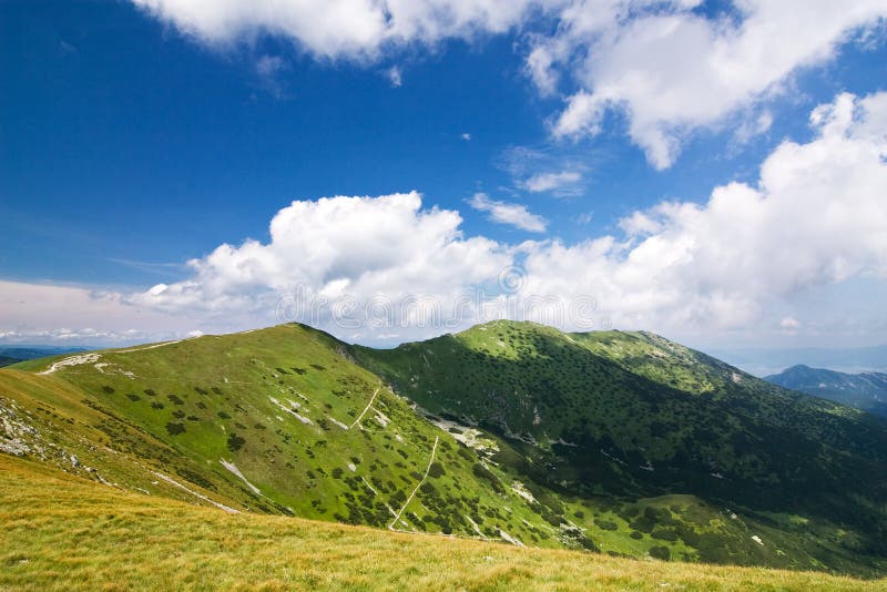 Mountain Ridge and Blue Sky with Clouds Stock Photo - Image of outdoor ...