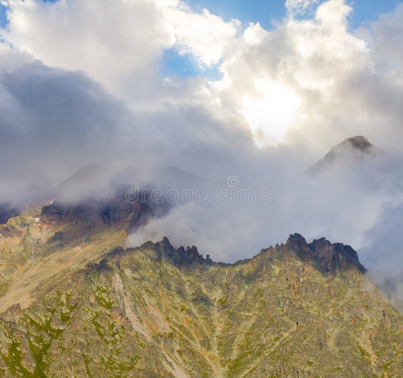 Mountain Ridge in Dense Mist and Clouds Stock Photo - Image of mist ...