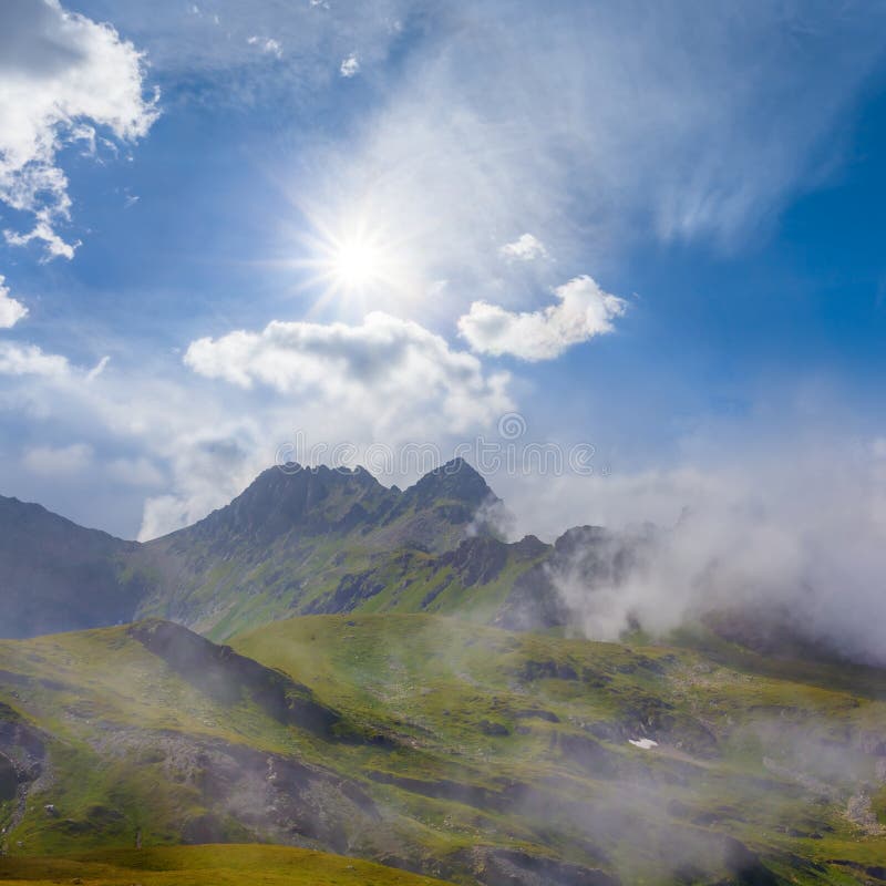 Mountain Ridge in Dense Mist and Clouds Stock Photo - Image of mist ...