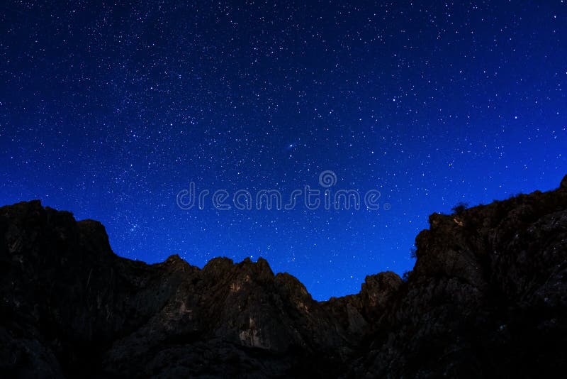 The Mountain Ridge Under a Starry Sky Stock Photo - Image of beautiful ...
