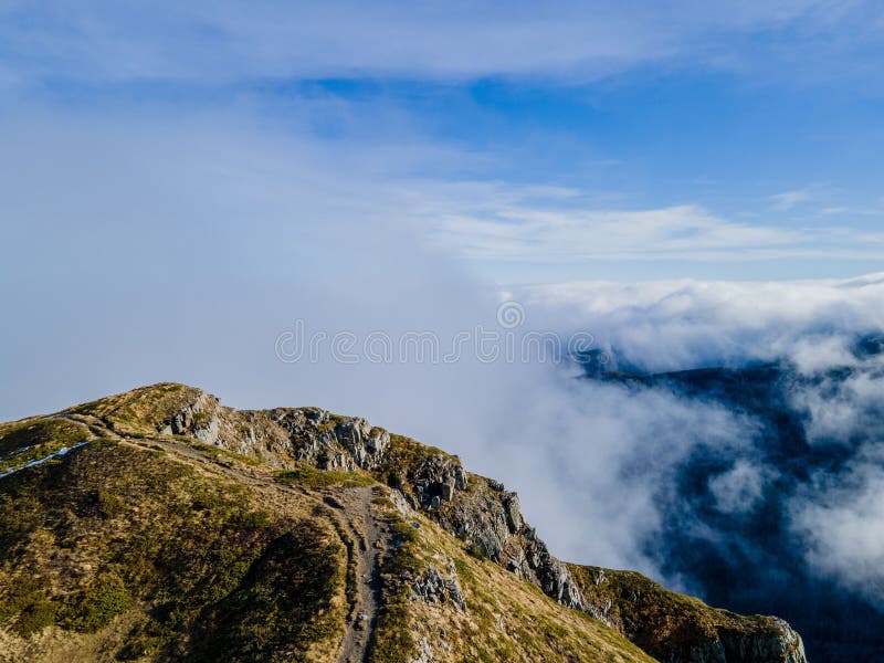 Mountain Ridge with Winding Path Under Blue Sky Stock Image - Image of ...
