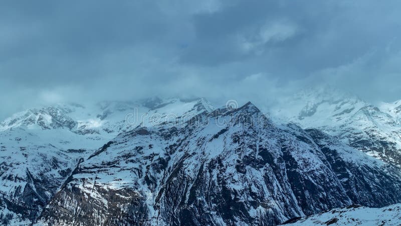 Mountain Ridge in Winter, with Clouds, Snow and Fog Stock Image - Image ...