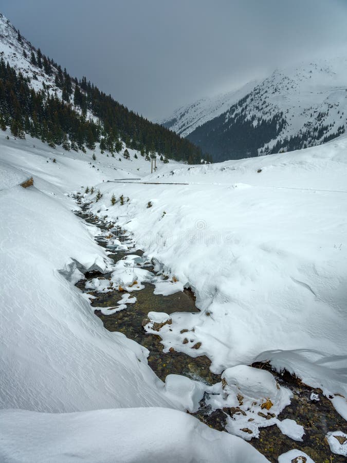 Mountain river and snow stock image. Image of stream - 107003799