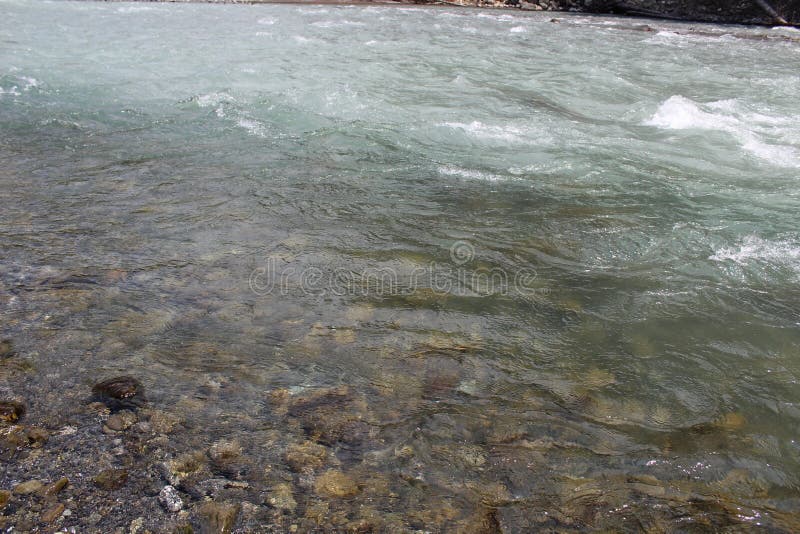 A Mountain River with Rushing Water from the Melting Snow Stock Photo ...