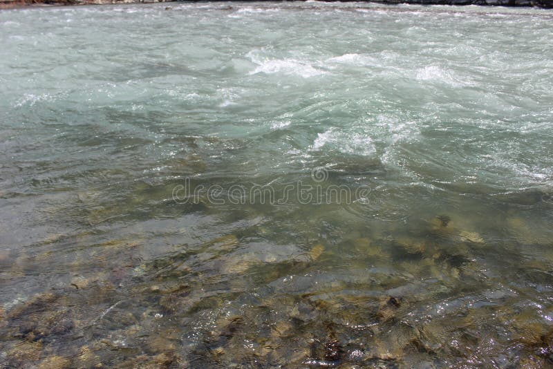 A Mountain River with Rushing Water from the Melting Snow Stock Image ...