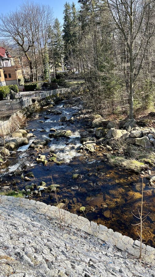 Mountain River, Stream of Water Flowing through a Mountain Village in ... Mountain River, Stream of Water Flowing through a Mountain Village in ...