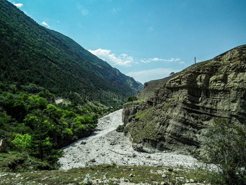 Mountain Road in Deep Canyon between Two Cliffs Under Blue Sky Stock ...