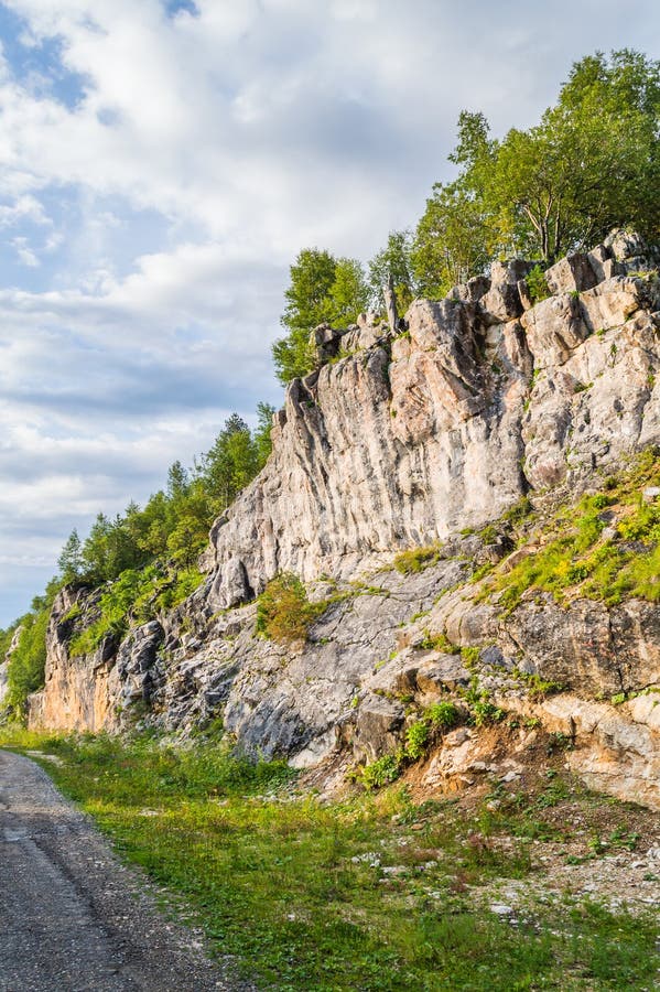 Mountain road near cliff stock image. Image of range - 75558015