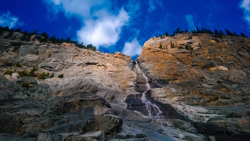 Mountain Rolling Over Sunlight and Clouds Cascade Mountain Water Fall ...