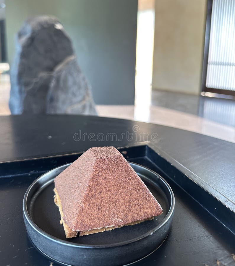 A Mountain-shaped Chocolate Cake with Almonds at Its Base Stock Photo ...