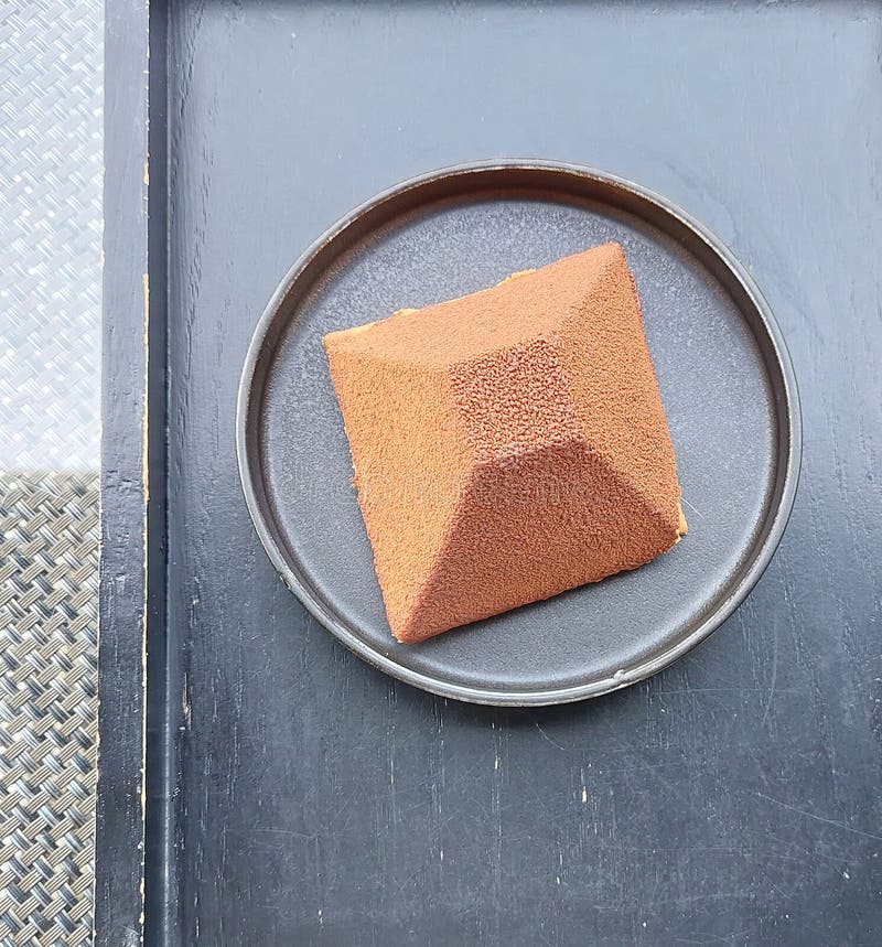 A Mountain-shaped Chocolate Cake with Almonds at Its Base Stock Photo ...