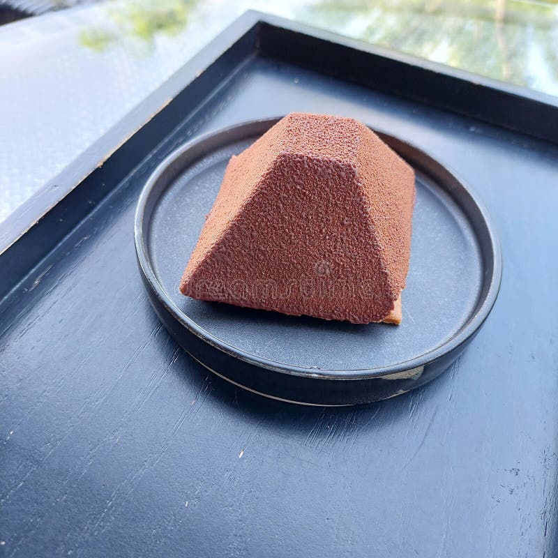 A Mountain-shaped Chocolate Cake with Almonds at Its Base Stock Image ...