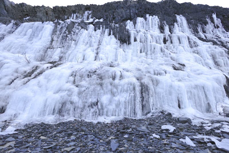 Mountain Side Covered in Frozen Falling Water Stock Photo - Image of ...