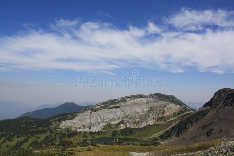 Mountain Side with Small Lake Stock Image - Image of hiker, hill: 10987717