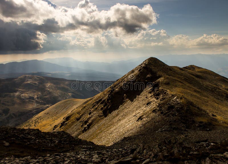 Mountain Side Sunlit by Sun Rays in the Pyrenees Stock Photo - Image of ...