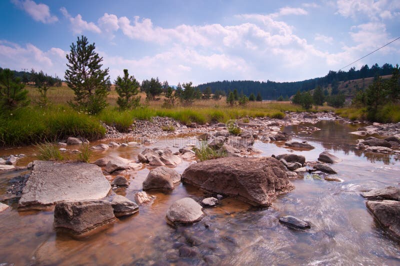 Mountain spring with rocks stock image. Image of beautiful - 16960089